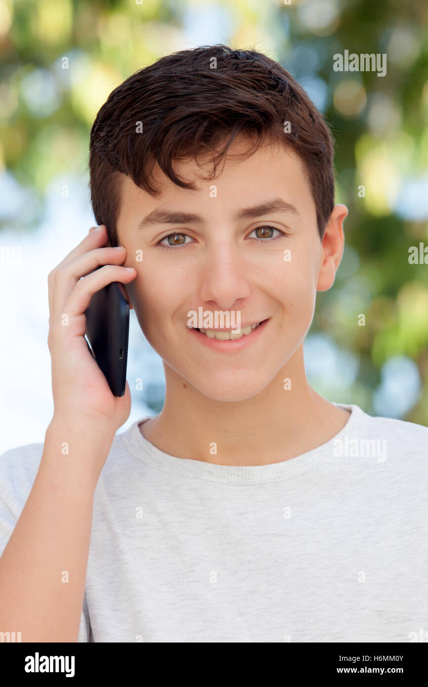 Teen boy talking on smartphone hi-res stock photography and images - Alamy