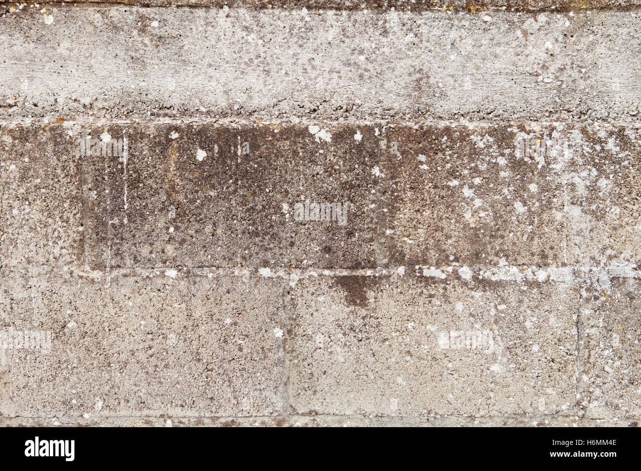 Grey wall of cement blocks damaged by the passage of time Stock Photo ...