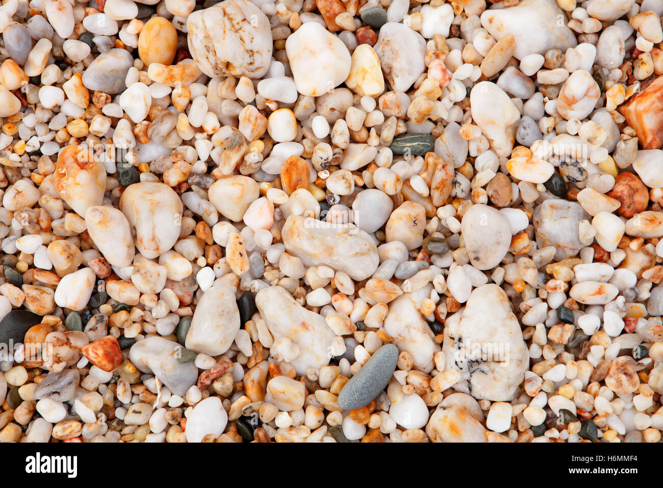 Wallpaper with small stones of the beach Stock Photo - Alamy