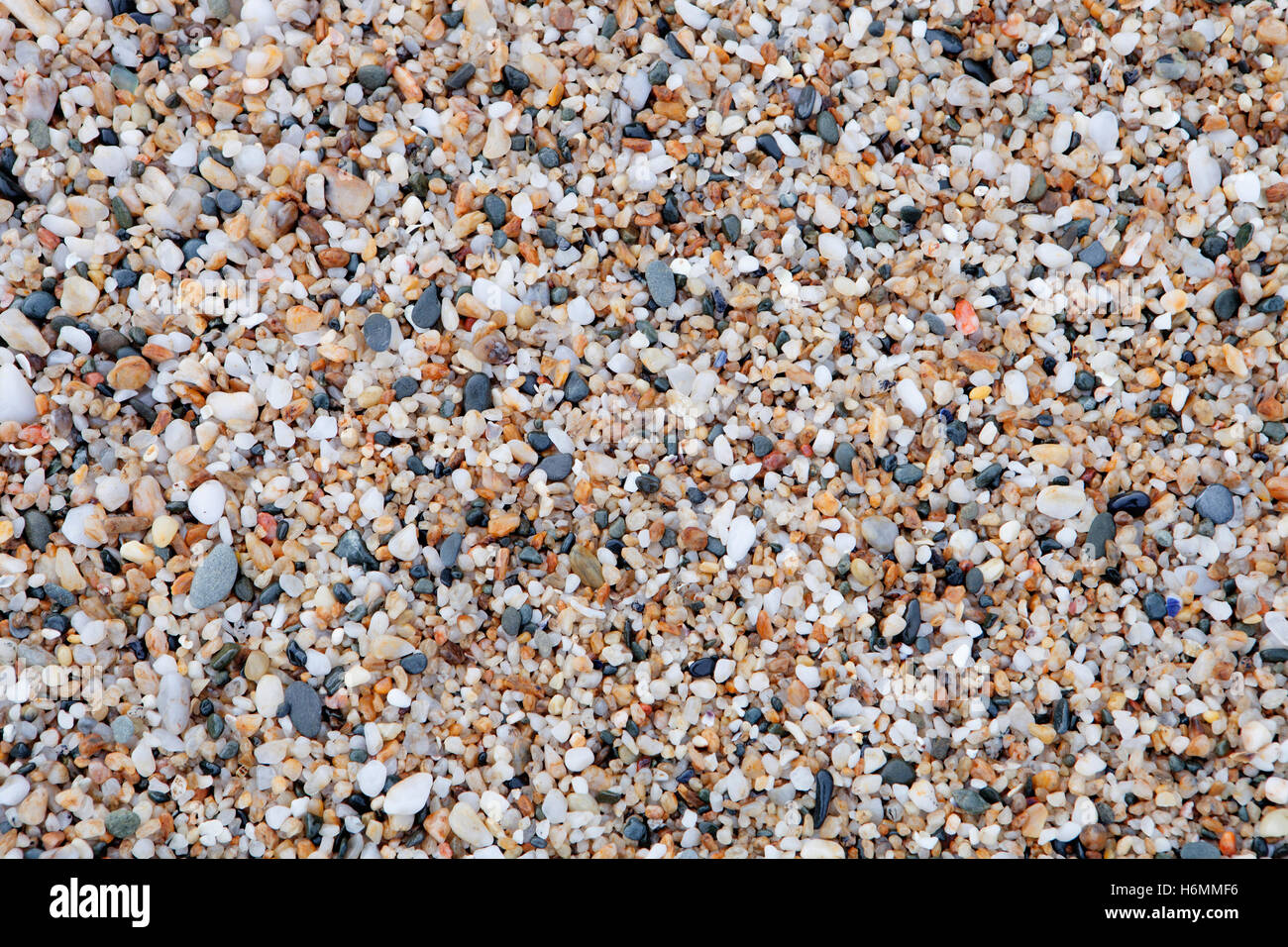 Wallpaper with small stones of the beach Stock Photo - Alamy