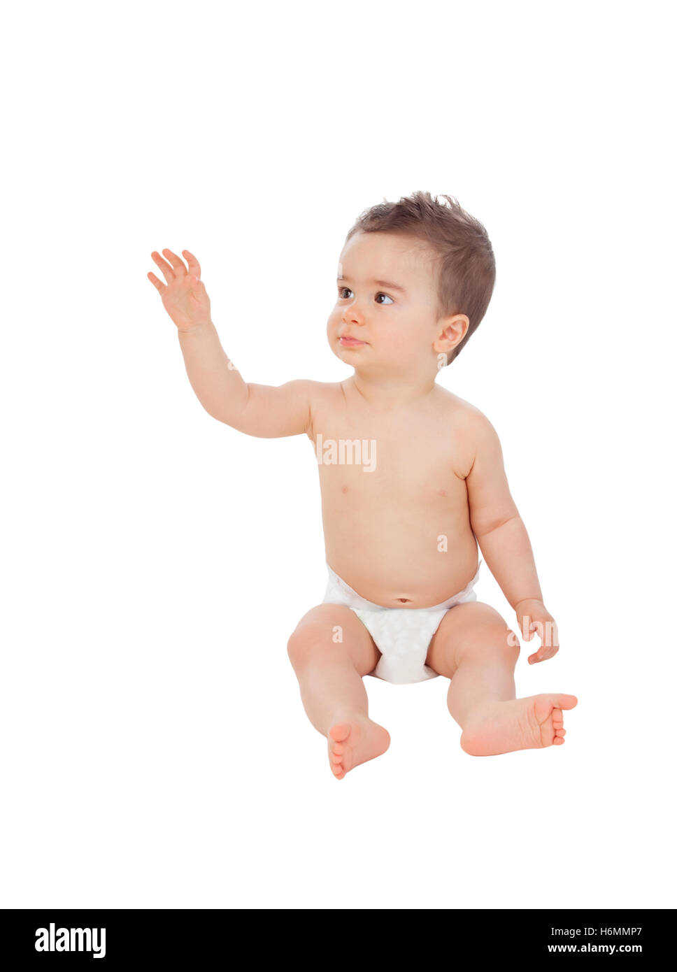 Cool little baby sitting on the floor with diaper isolated on a white ...