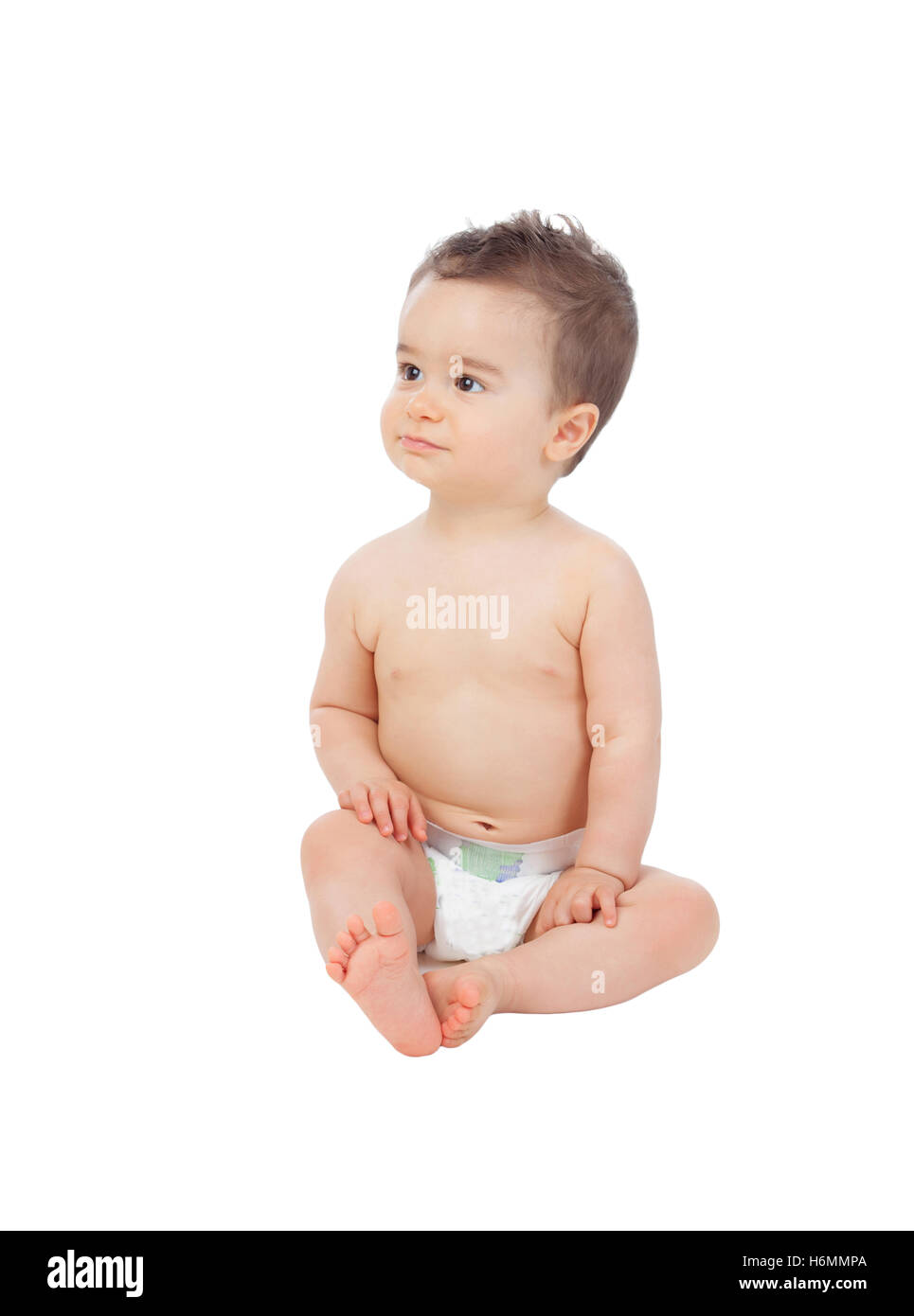 Cool little baby sitting on the floor with diaper isolated on a white ...