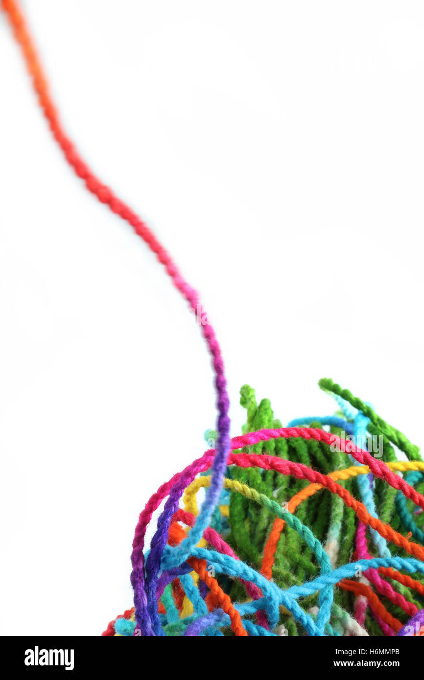 Tangled colorful sewing threads on white background Stock Photo - Alamy