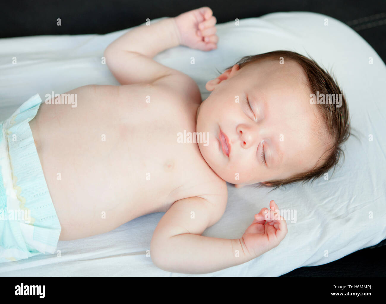 Beautiful baby sleeping the nap in the crib Stock Photo - Alamy