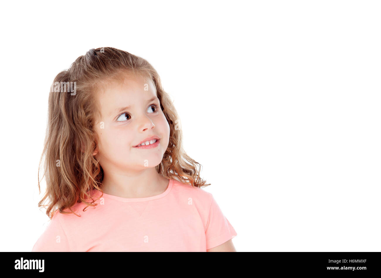 Cute little girl with three year old looking at side on a white ...
