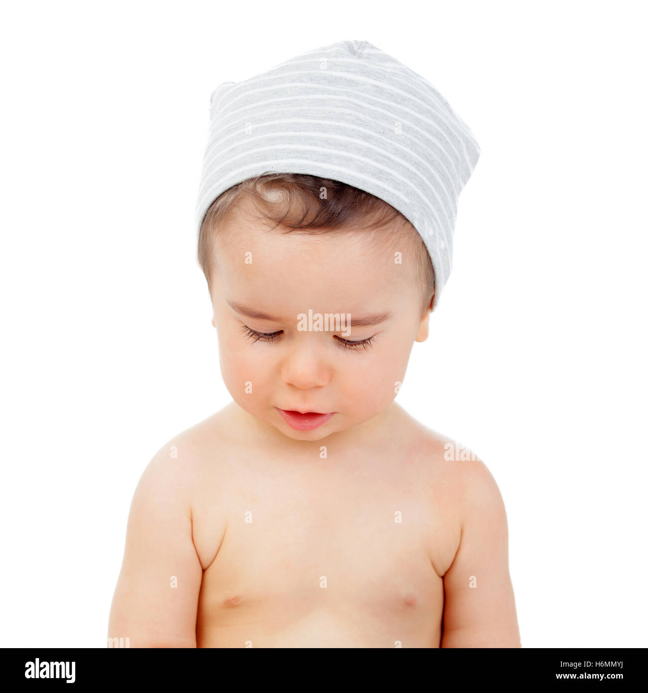 Nice baby looking down isolated on a white background Stock Photo - Alamy