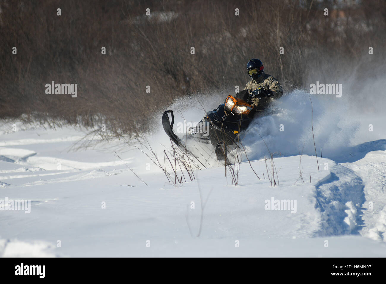 Snowmobile riding on snowy mountain hi-res stock photography and images ...