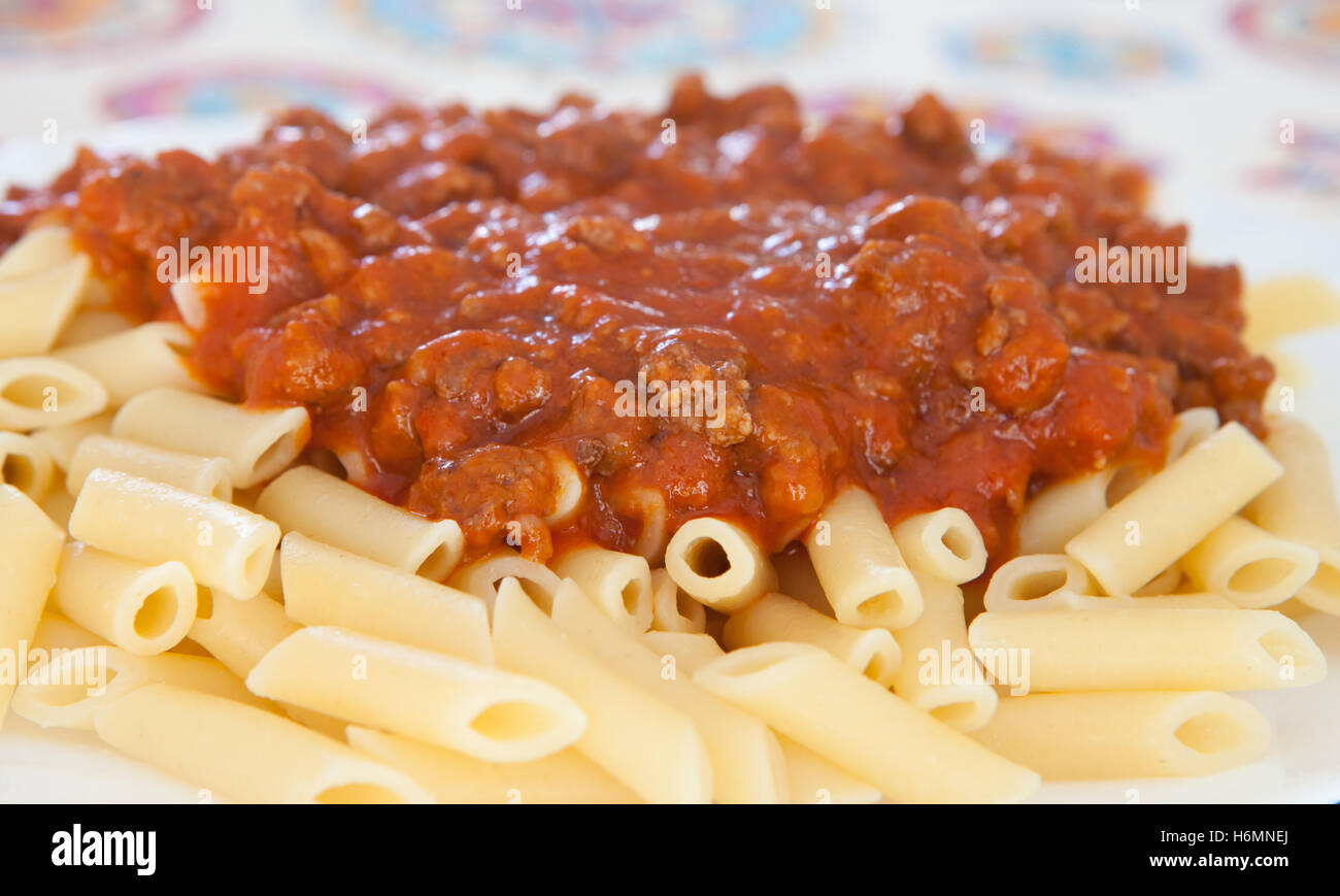 Delicious plate of macaroni with tomato close up Stock Photo - Alamy