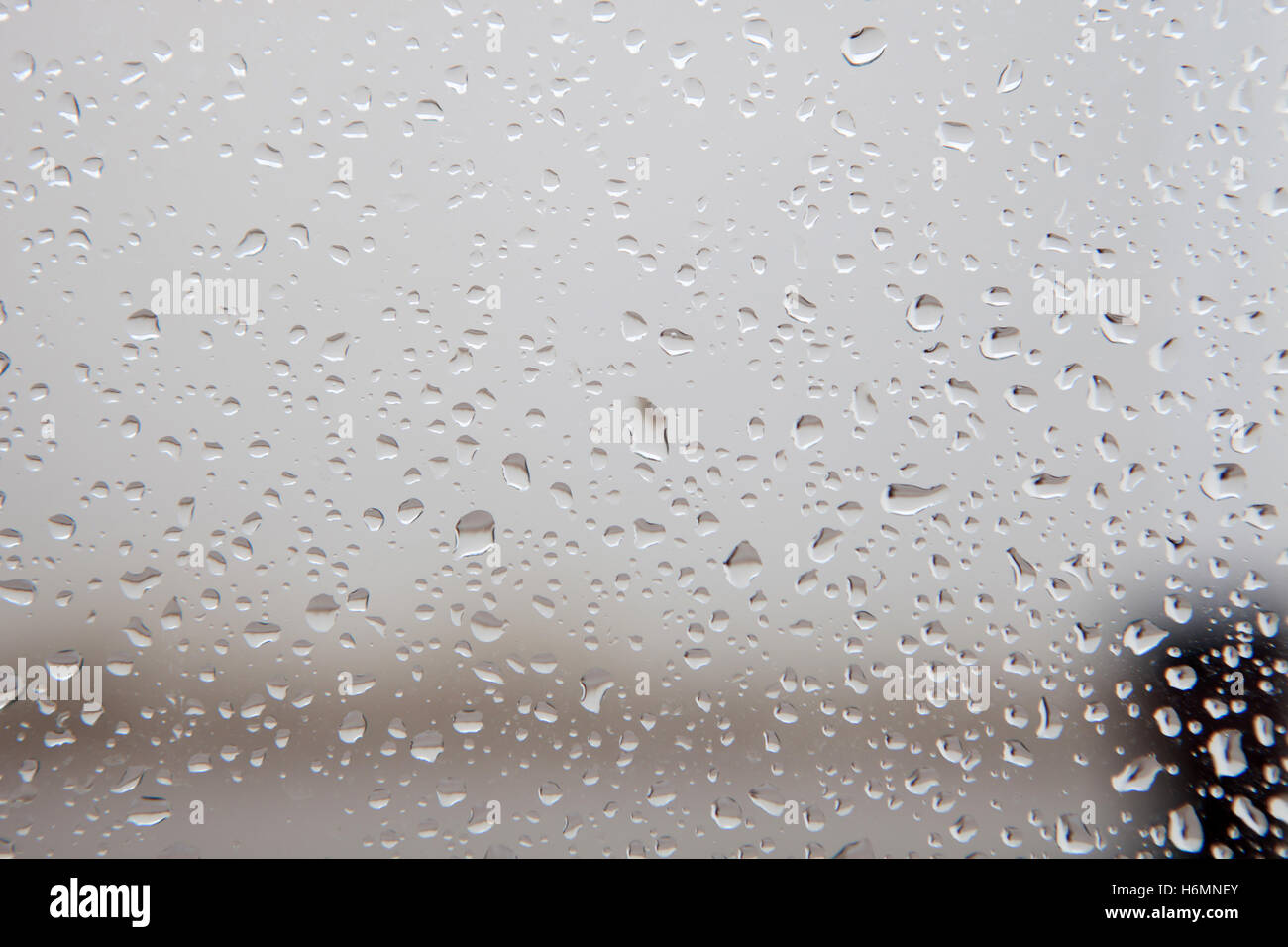 Wet glass with drops of rain fall on the street Stock Photo - Alamy