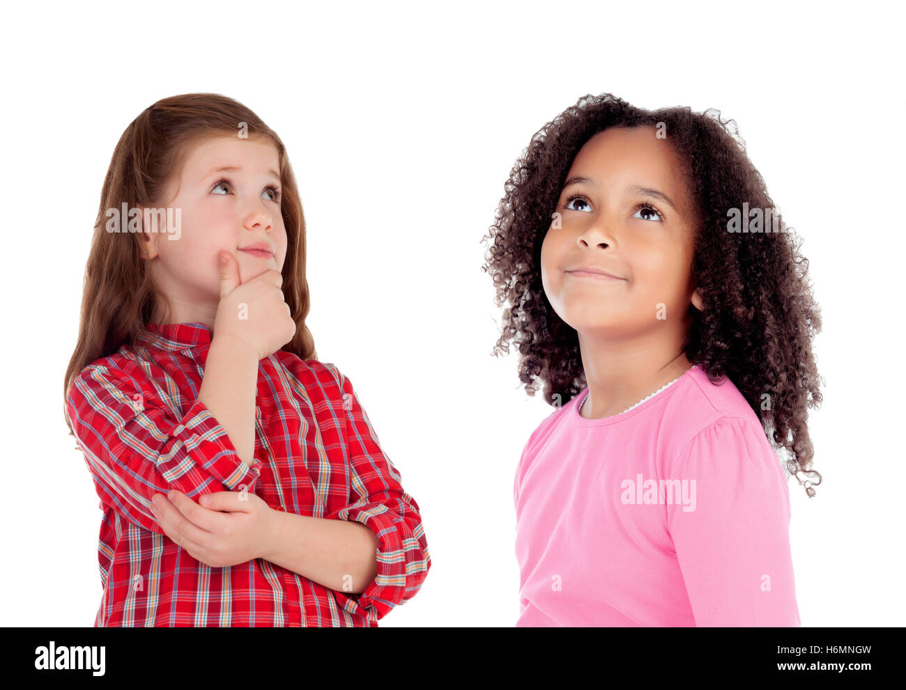 Two beautiful girls thinking isolated on a white background Stock Photo ...