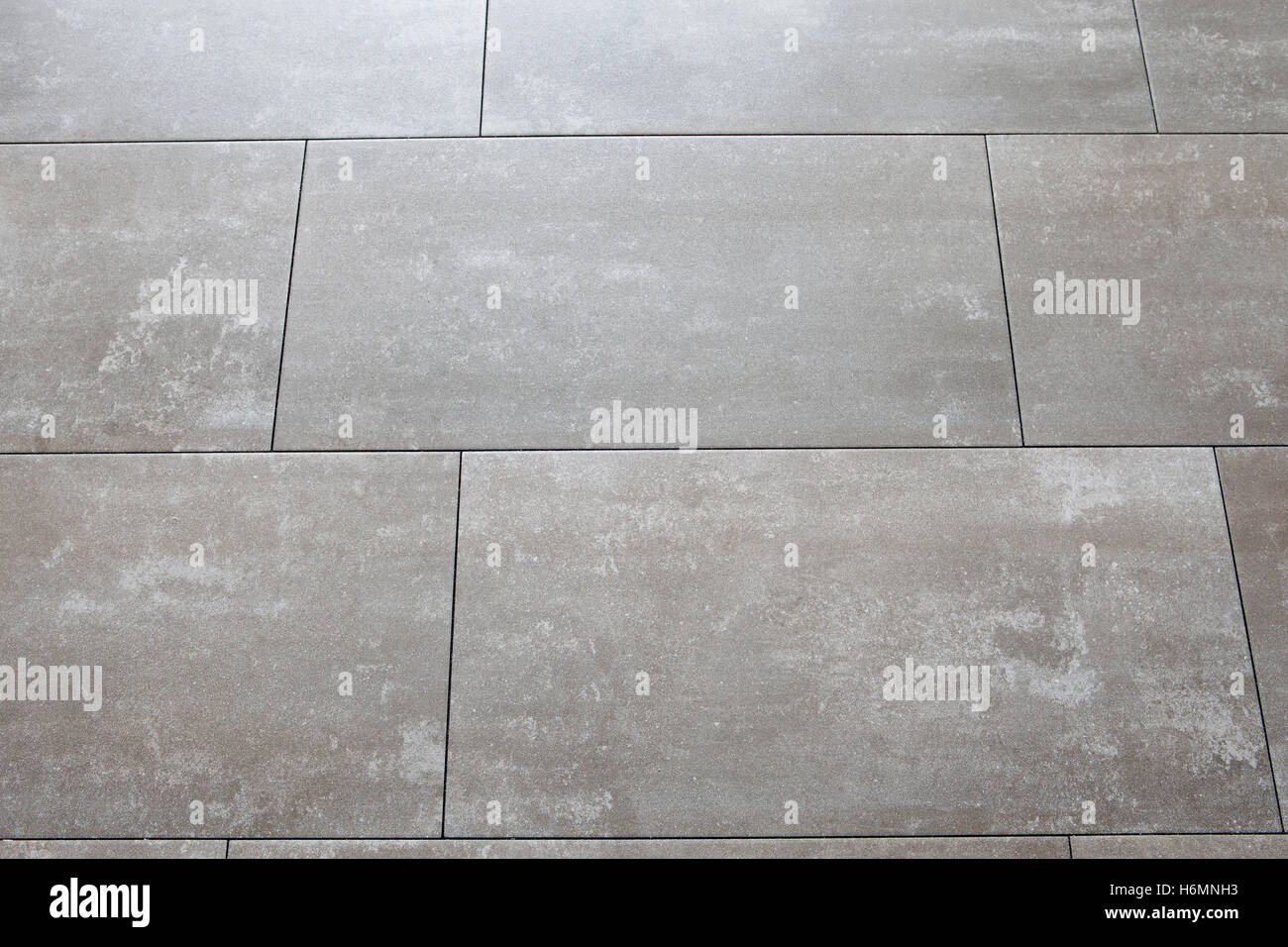 Photo of grey floors with large tile horizontally Stock Photo - Alamy