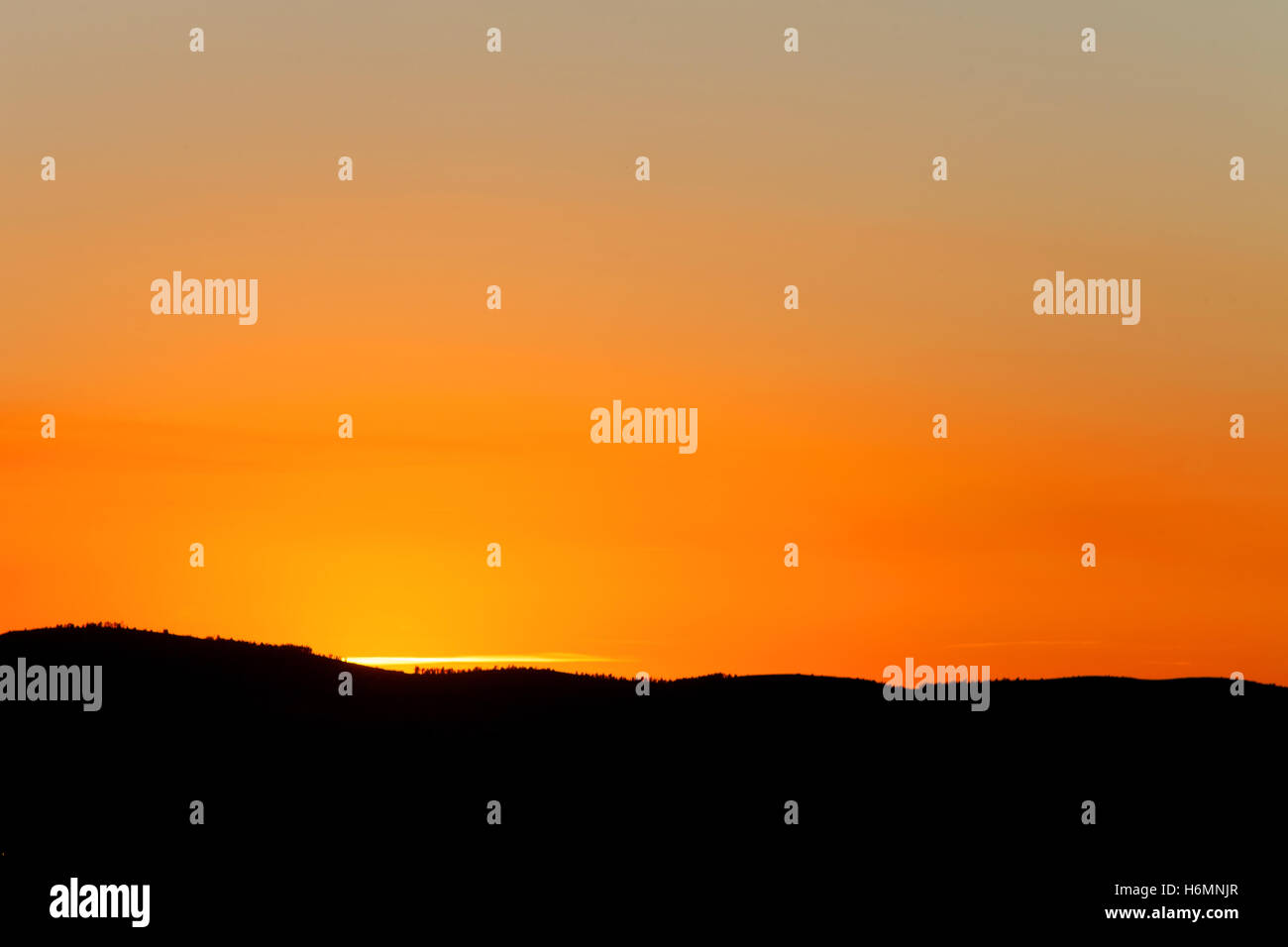 Photo of a beautiful sunset with an orange sky Stock Photo - Alamy