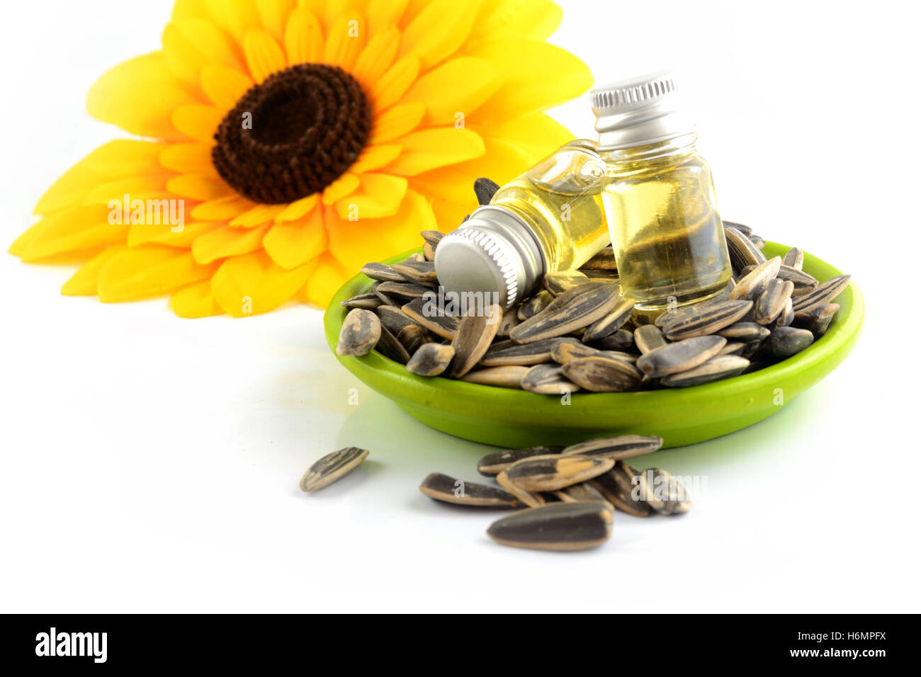 Sunflower seed with drop of oil in the bottle Stock Photo - Alamy