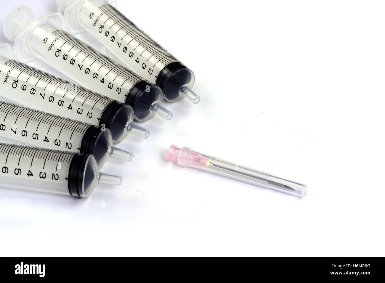 Medical syringes on a white Stock Photo - Alamy