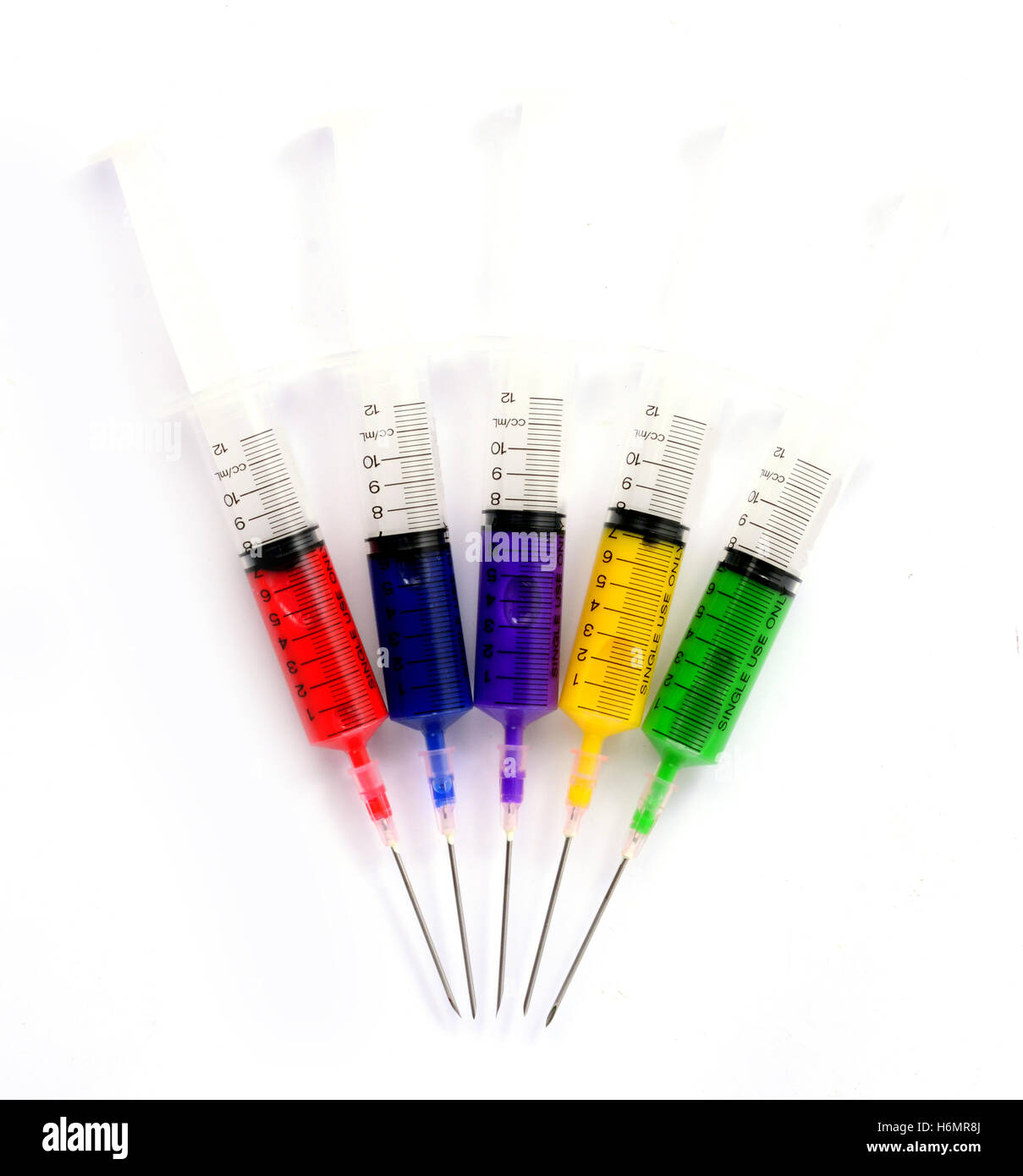Syringe filled with colors Stock Photo - Alamy