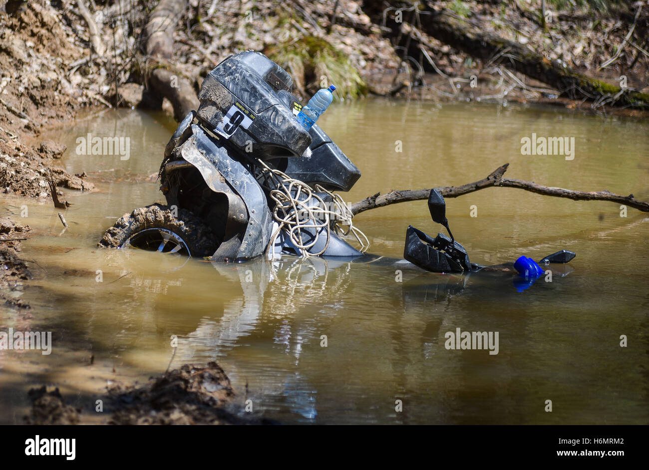 ATV drowned in a large puddle Stock Photo - Alamy