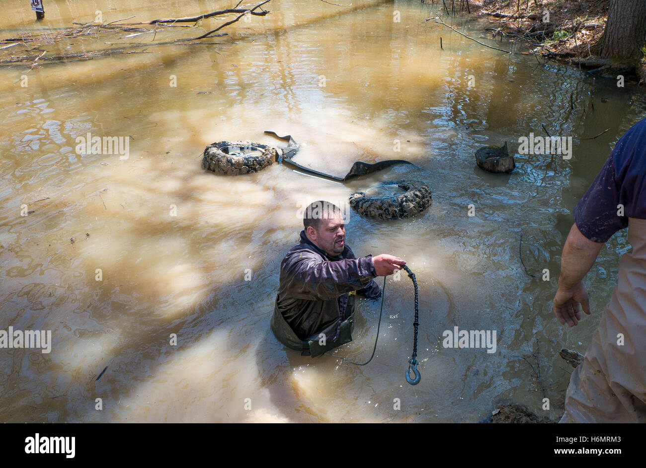ATV drowned in a large puddle Stock Photo - Alamy