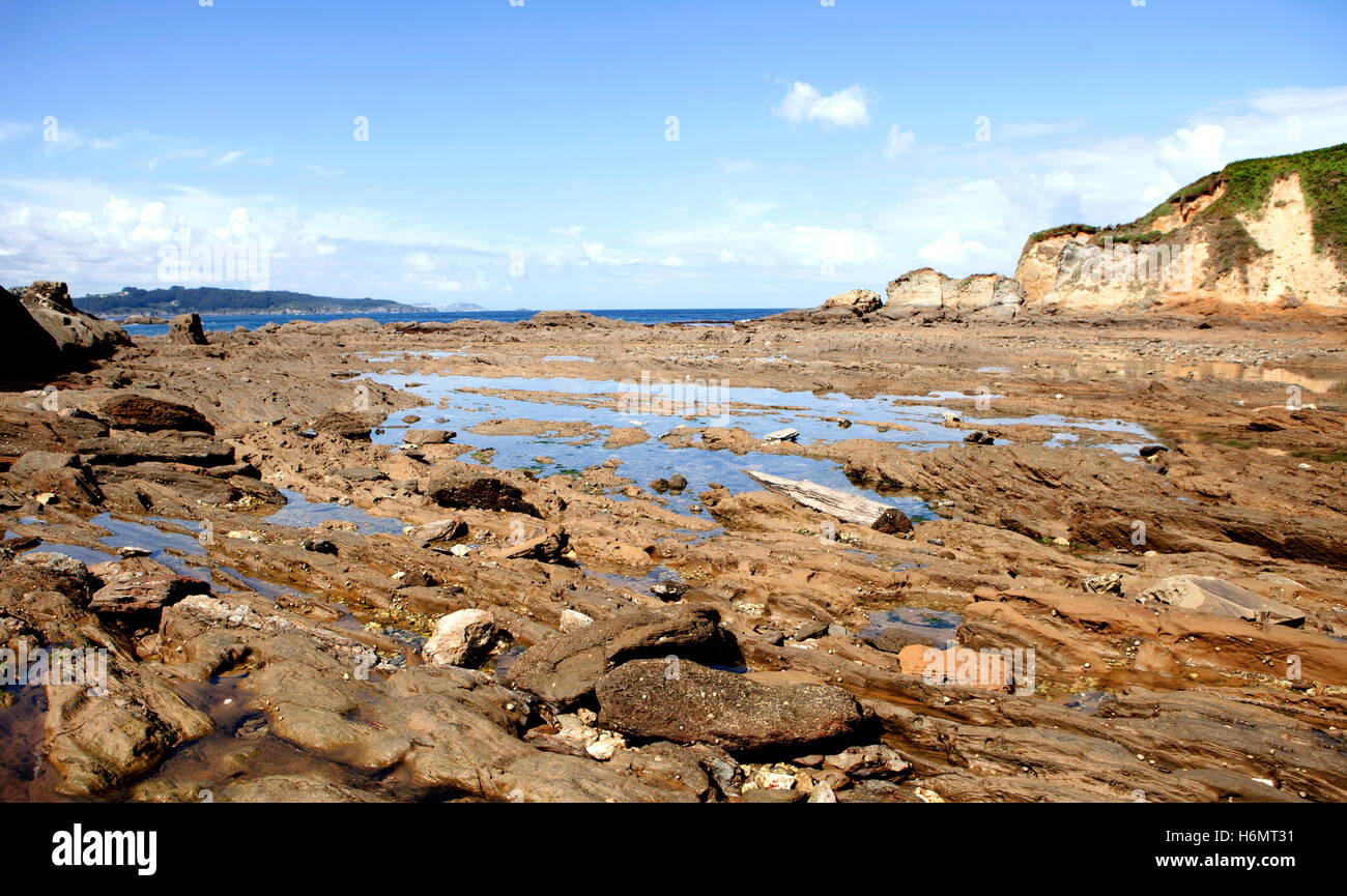 Beautiful seascape. Puddle of water on the rock at low tide Stock Photo ...