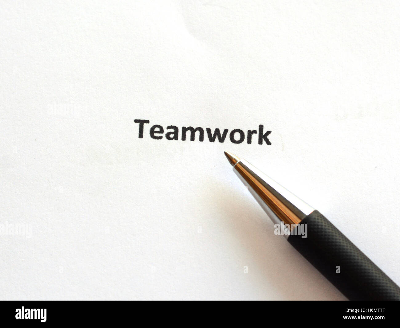 Teamwork with pen isolated Stock Photo - Alamy