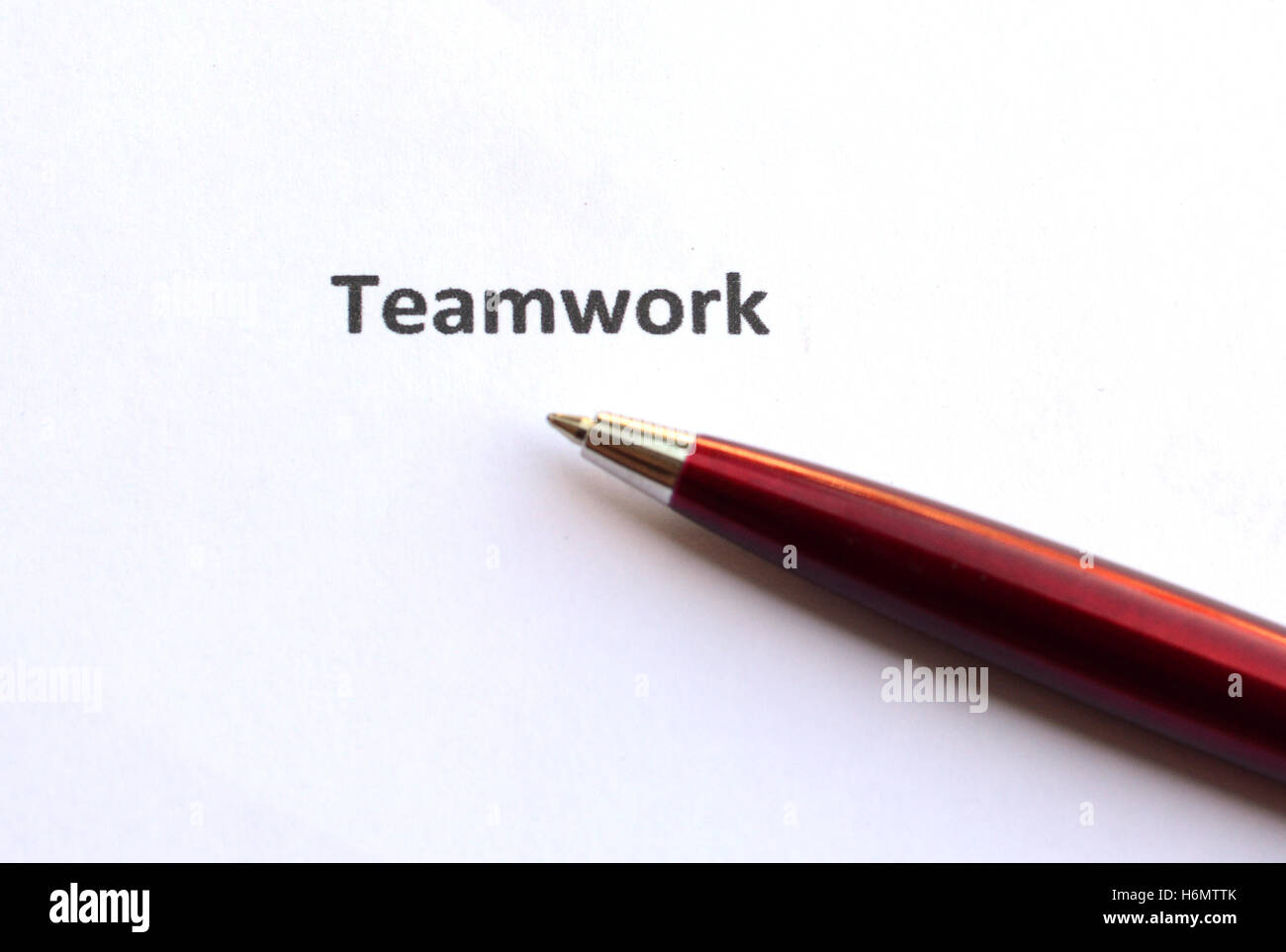 Teamwork with pen isolated Stock Photo - Alamy