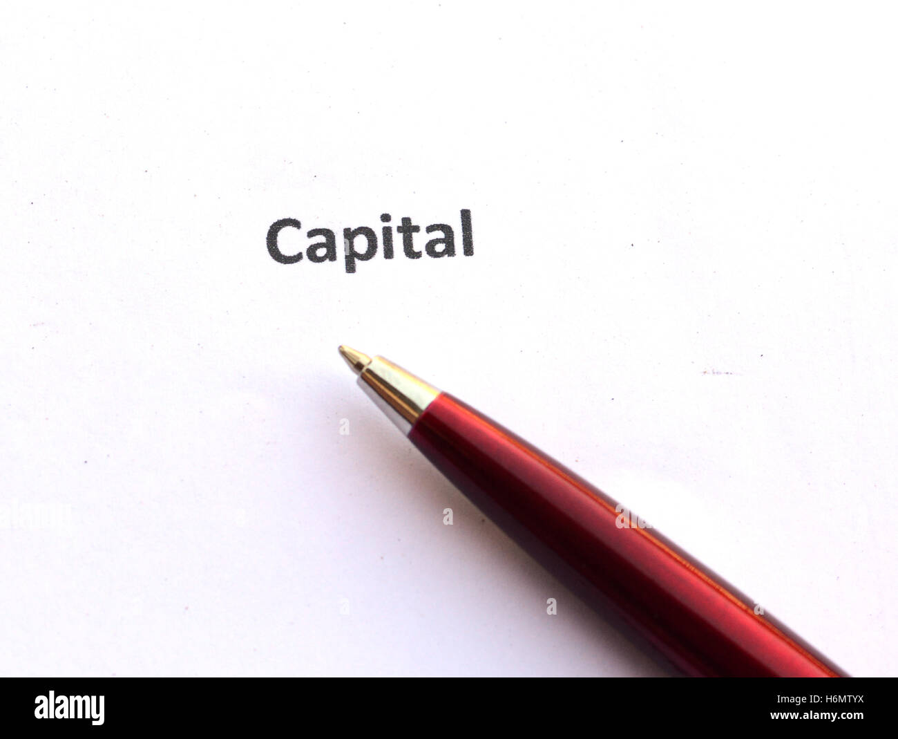 Capital with pen Stock Photo - Alamy