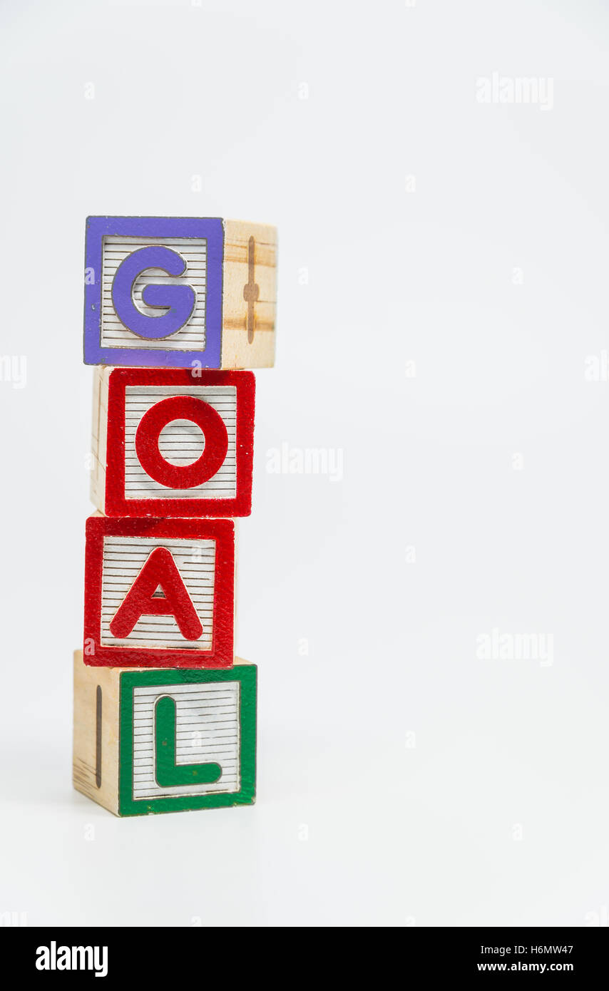 GOAL word wooden block arrange in vertical style on white background ...