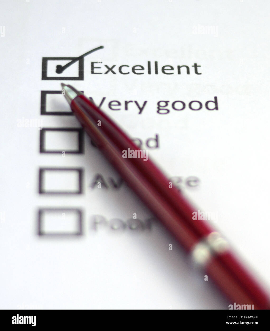 Tick placed in Excellent Stock Photo - Alamy