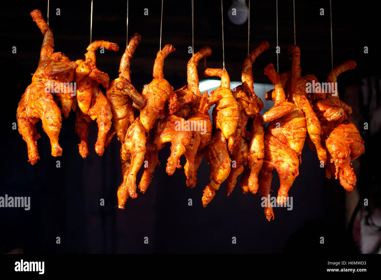 roasted chicken hanging in shop in streets of Jaipur, Rajasthan Stock ...