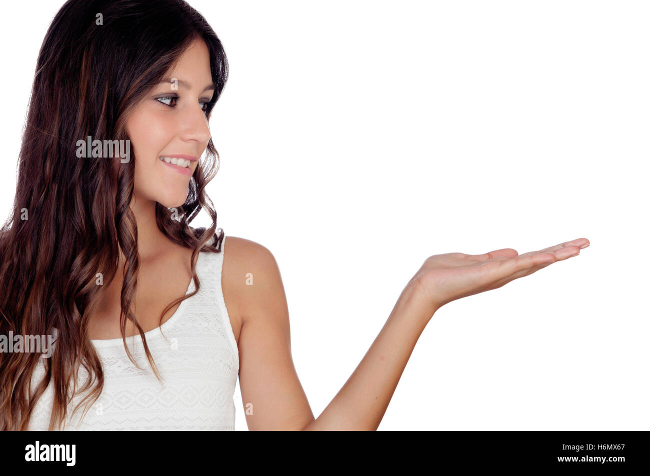 Attractive casual girl with the hand extended isolated on white Stock ...