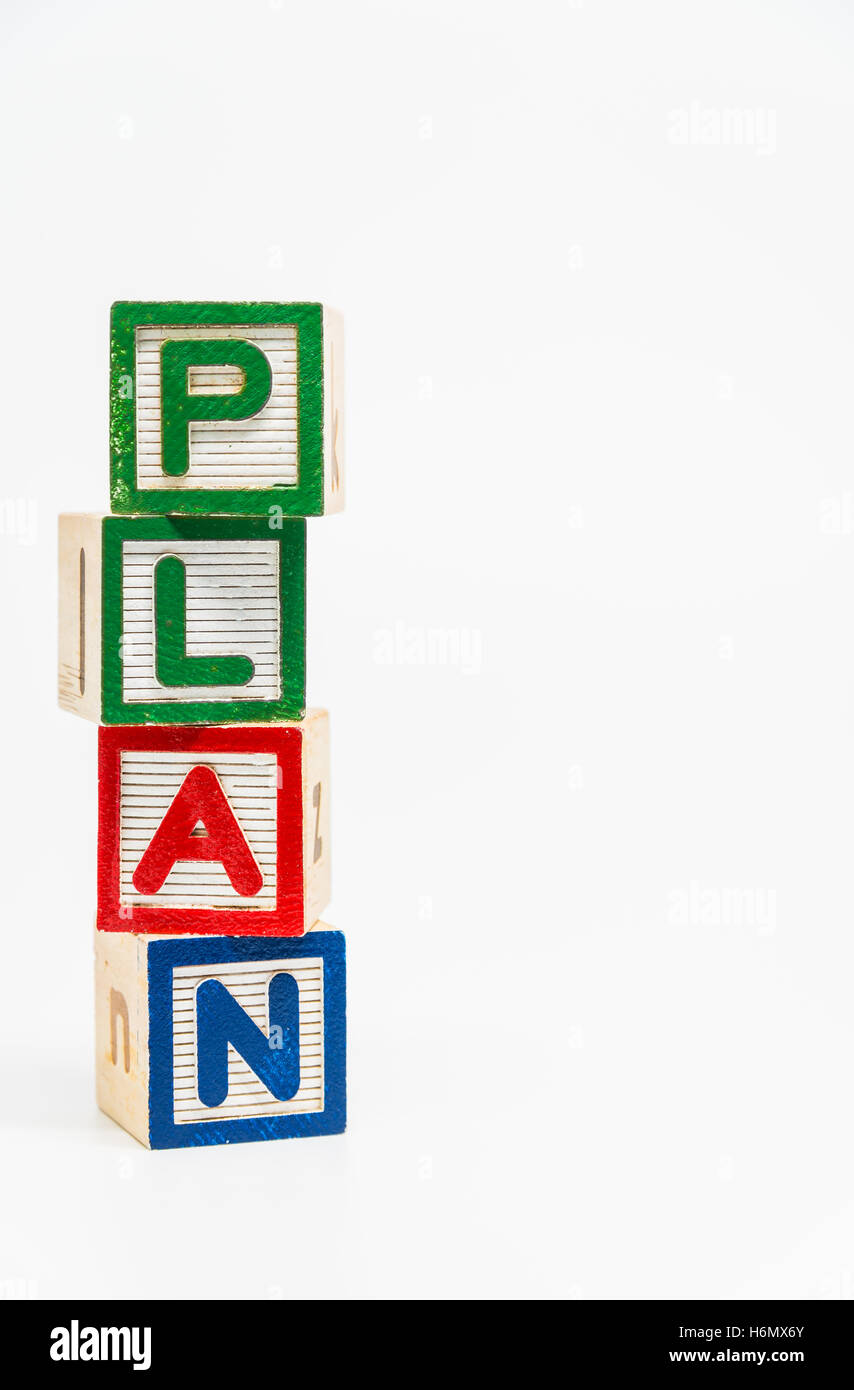 PLAN word wooden block arrange in vertical style on white background ...