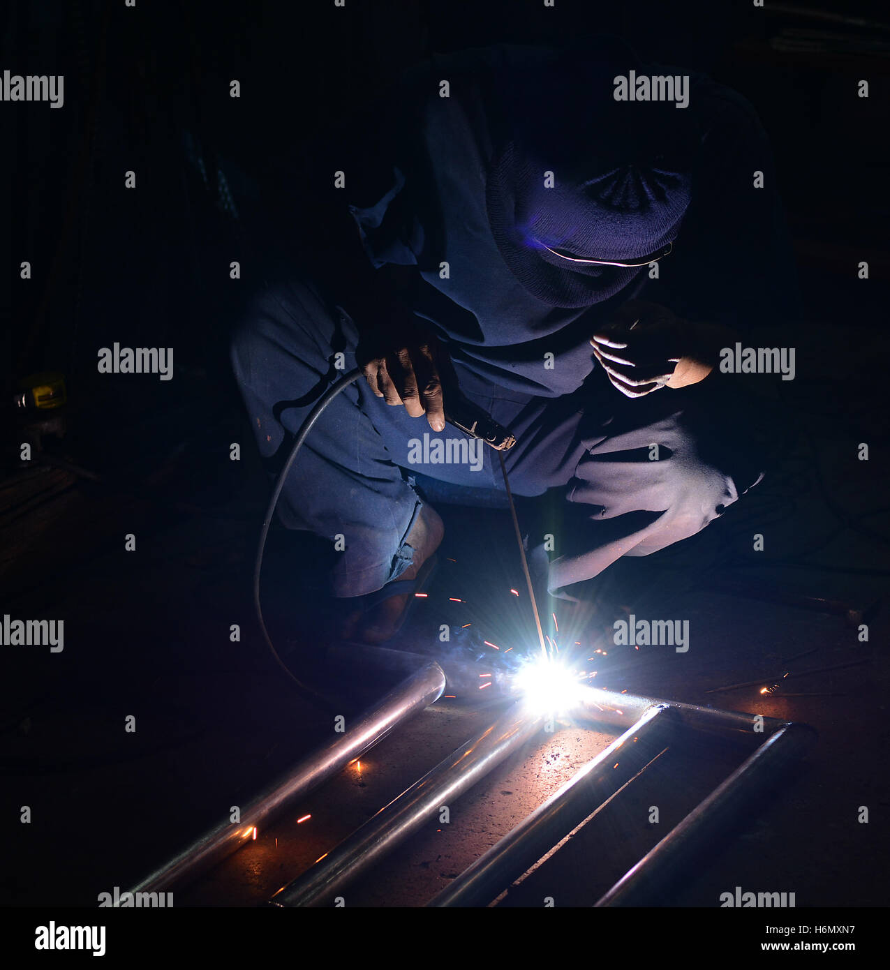 Construction worker in orange welding hi-res stock photography and ...
