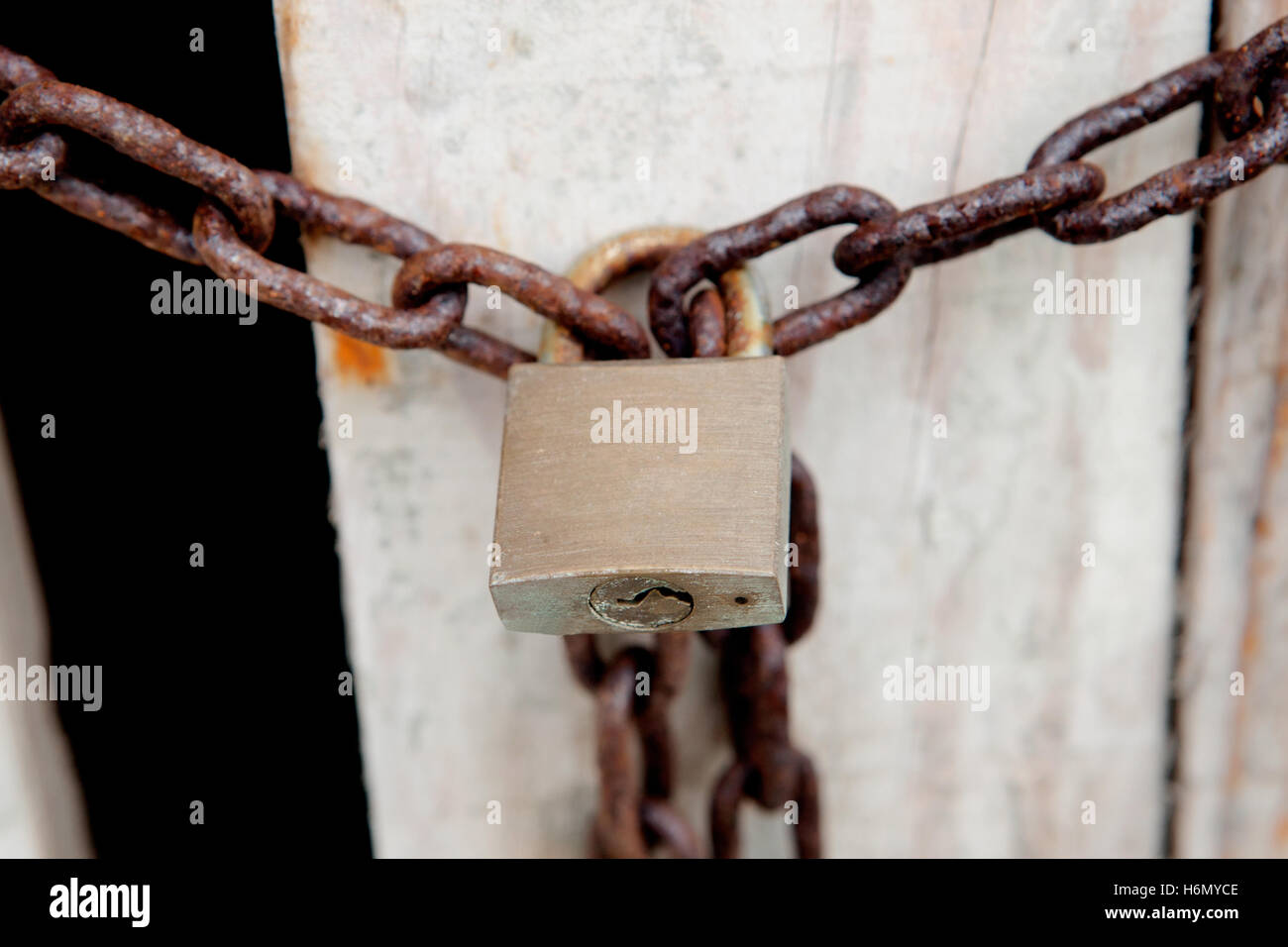 Private property. Closed padlock with rusty chain Stock Photo - Alamy