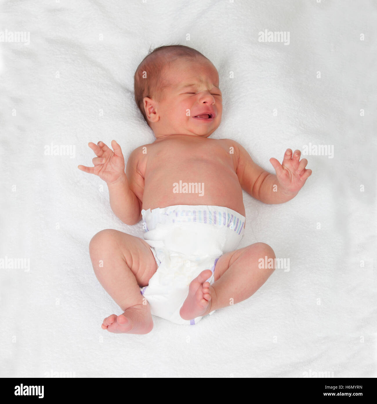 Adorable baby newborn crying isolated on a white background Stock Photo ...