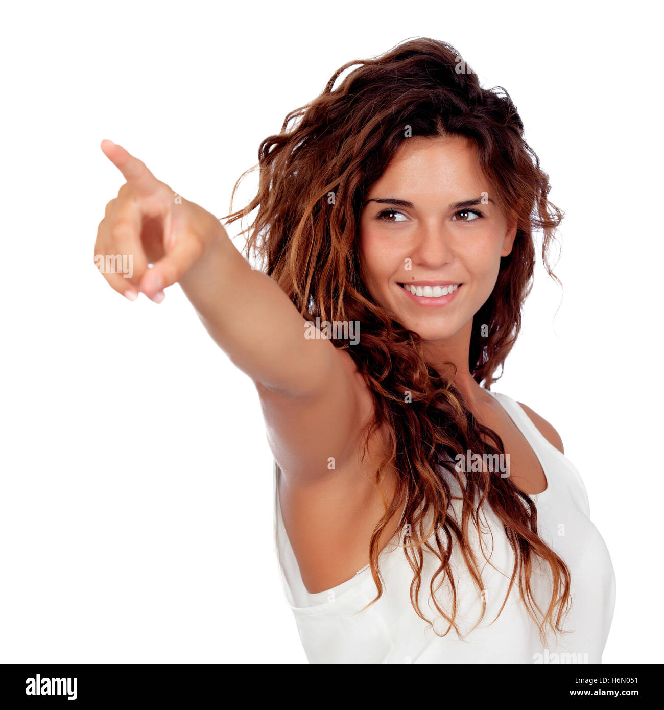 Natural girl with curly hair indicating something isolated on a white ...