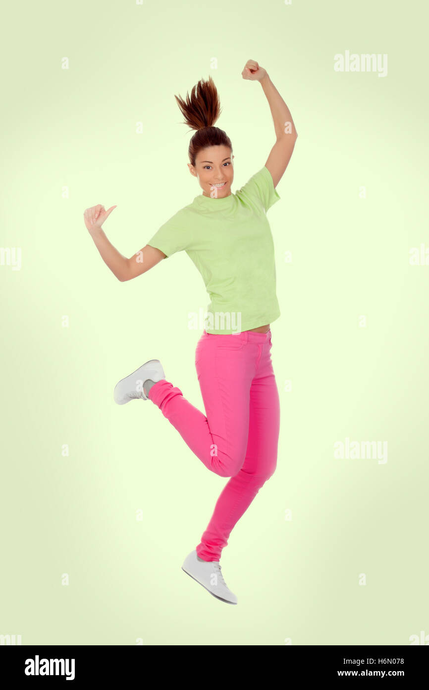 Happy winner girl isolated on a green background Stock Photo - Alamy