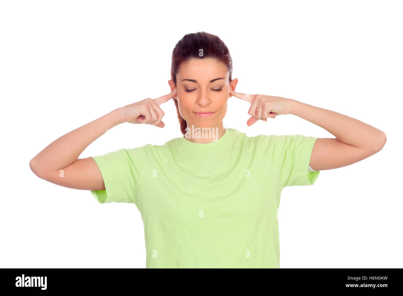 Smiling woman covering her ears isolated on a white background Stock ...