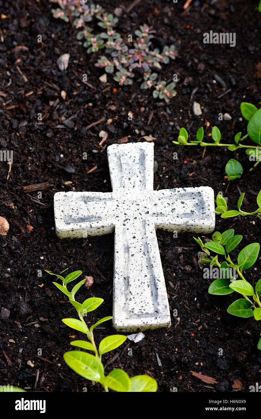 stone cross on the ground Stock Photo - Alamy