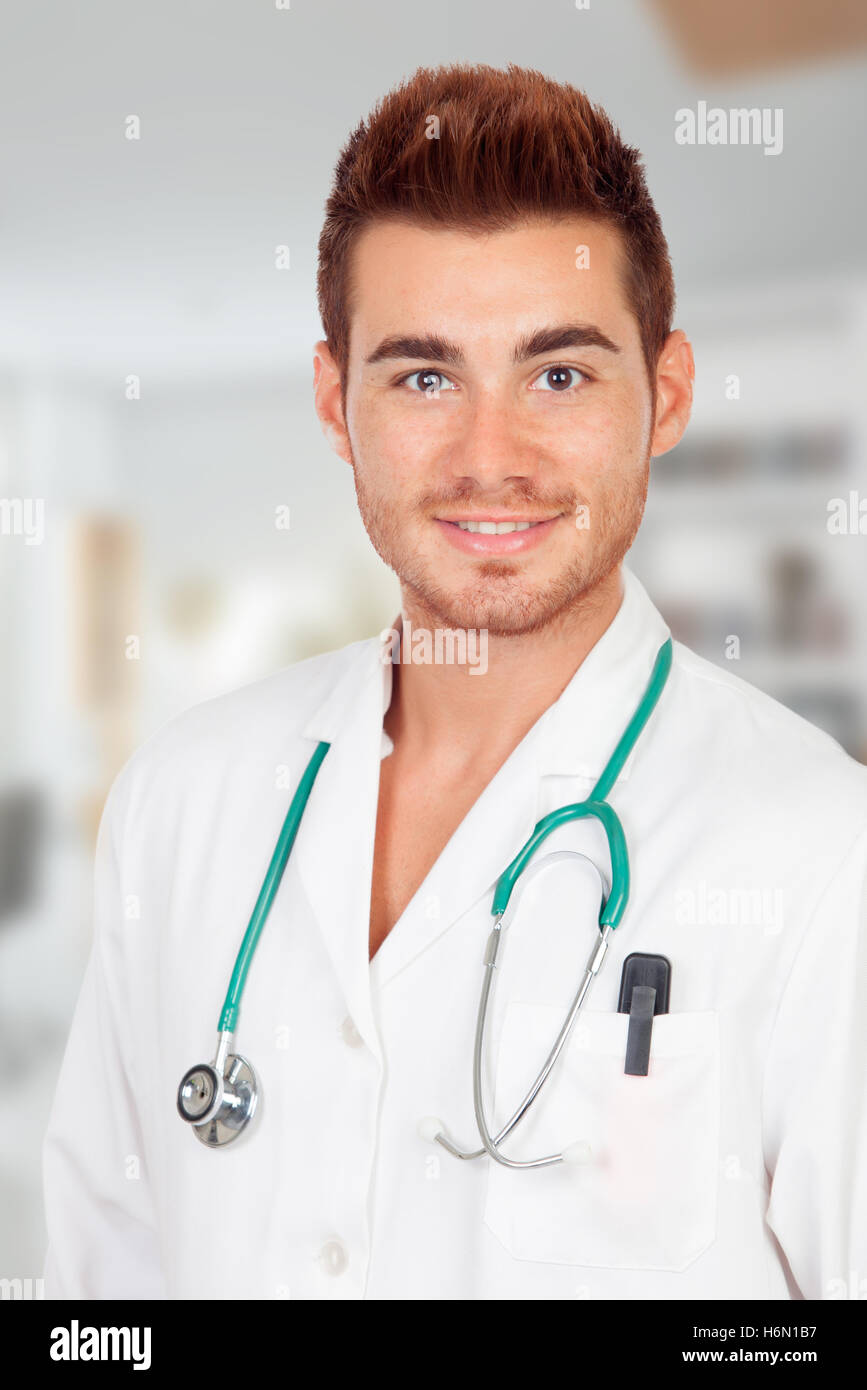 Young attractive doctor working in the hospital Stock Photo - Alamy
