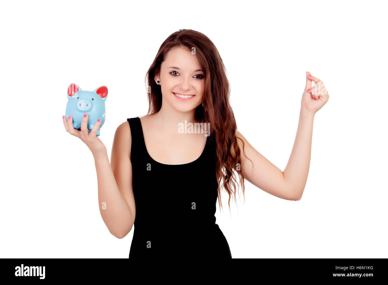 Casual young girl with a blue moneybox isolated on a white background ...