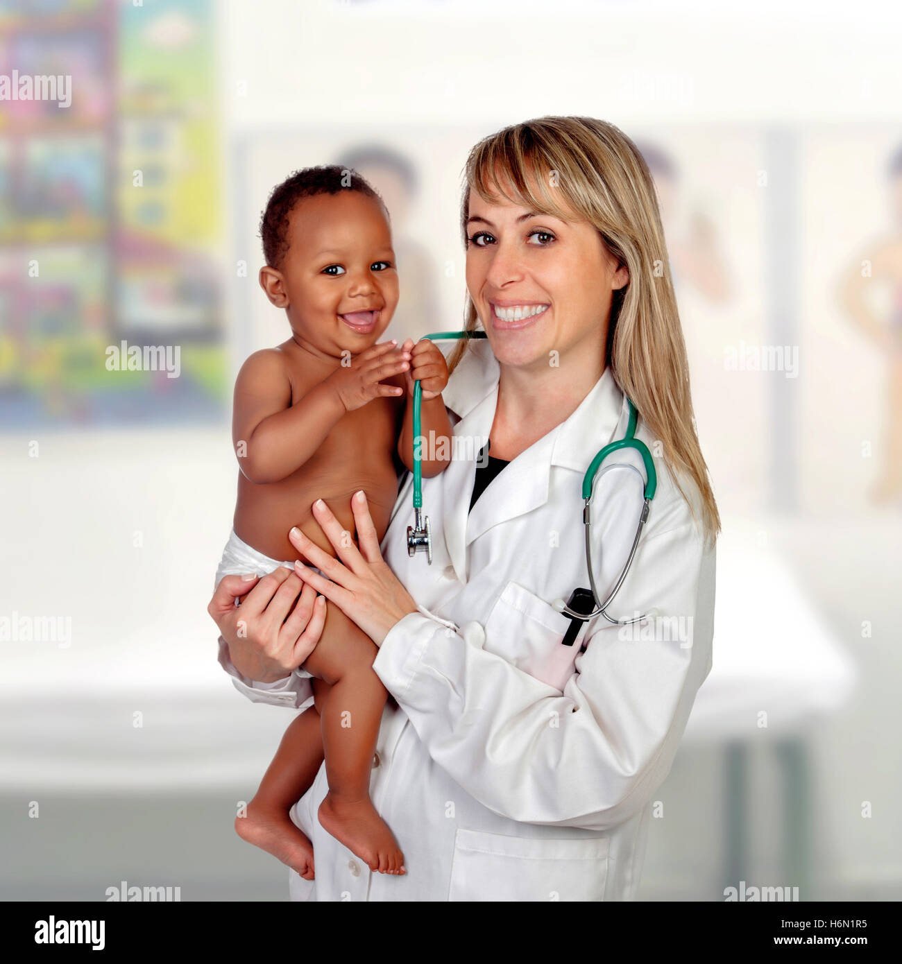 Adorable baby with his pediatrician isolated on a white background ...