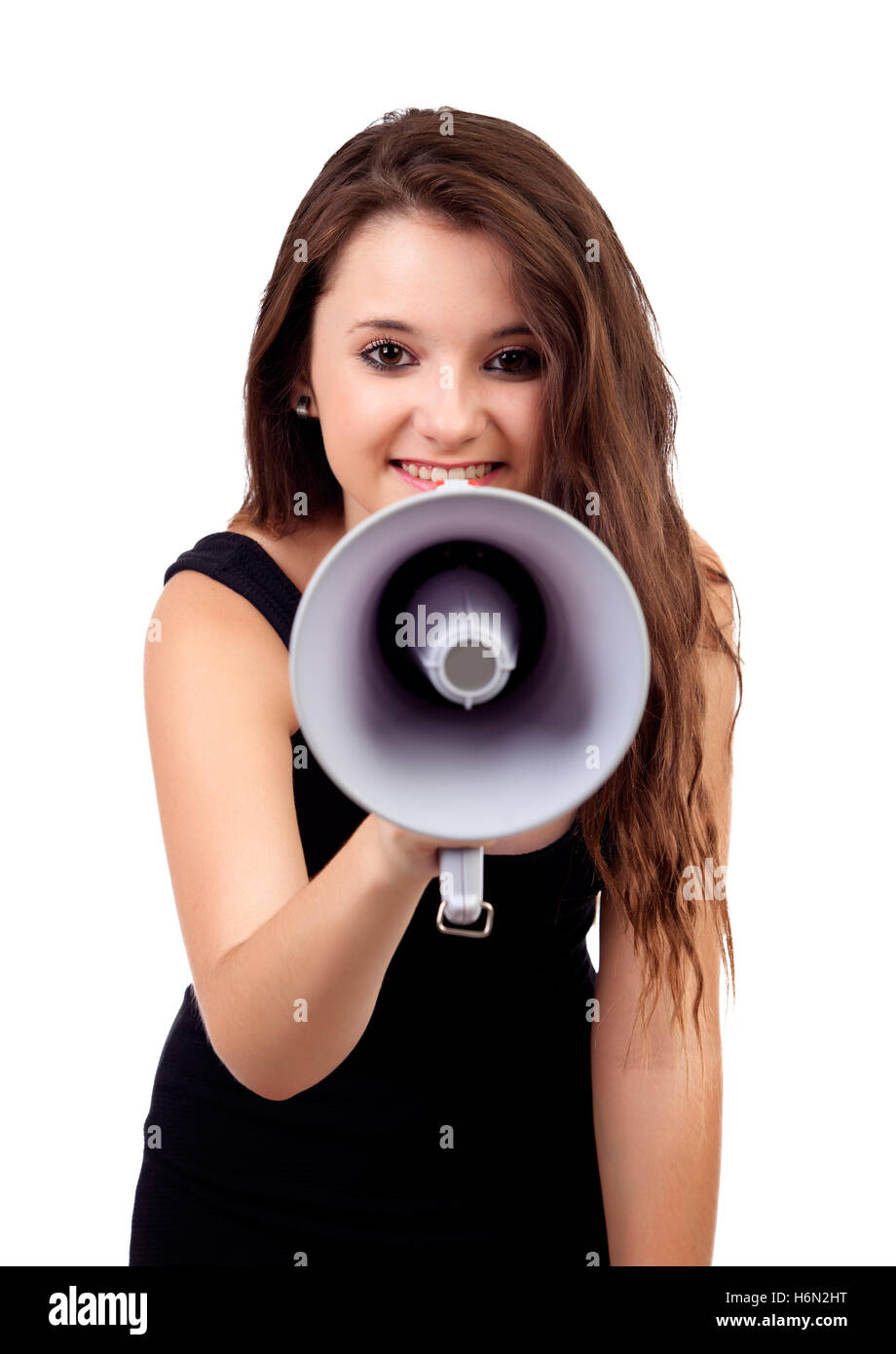 Funny girl shouting with a megaphone isolated on a white background ...