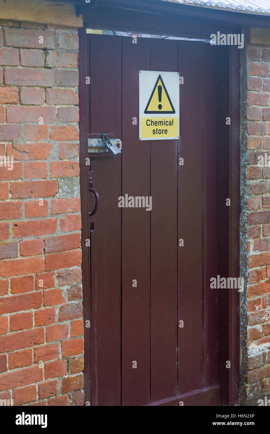 Chemical store sign on padlocked door Stock Photo - Alamy