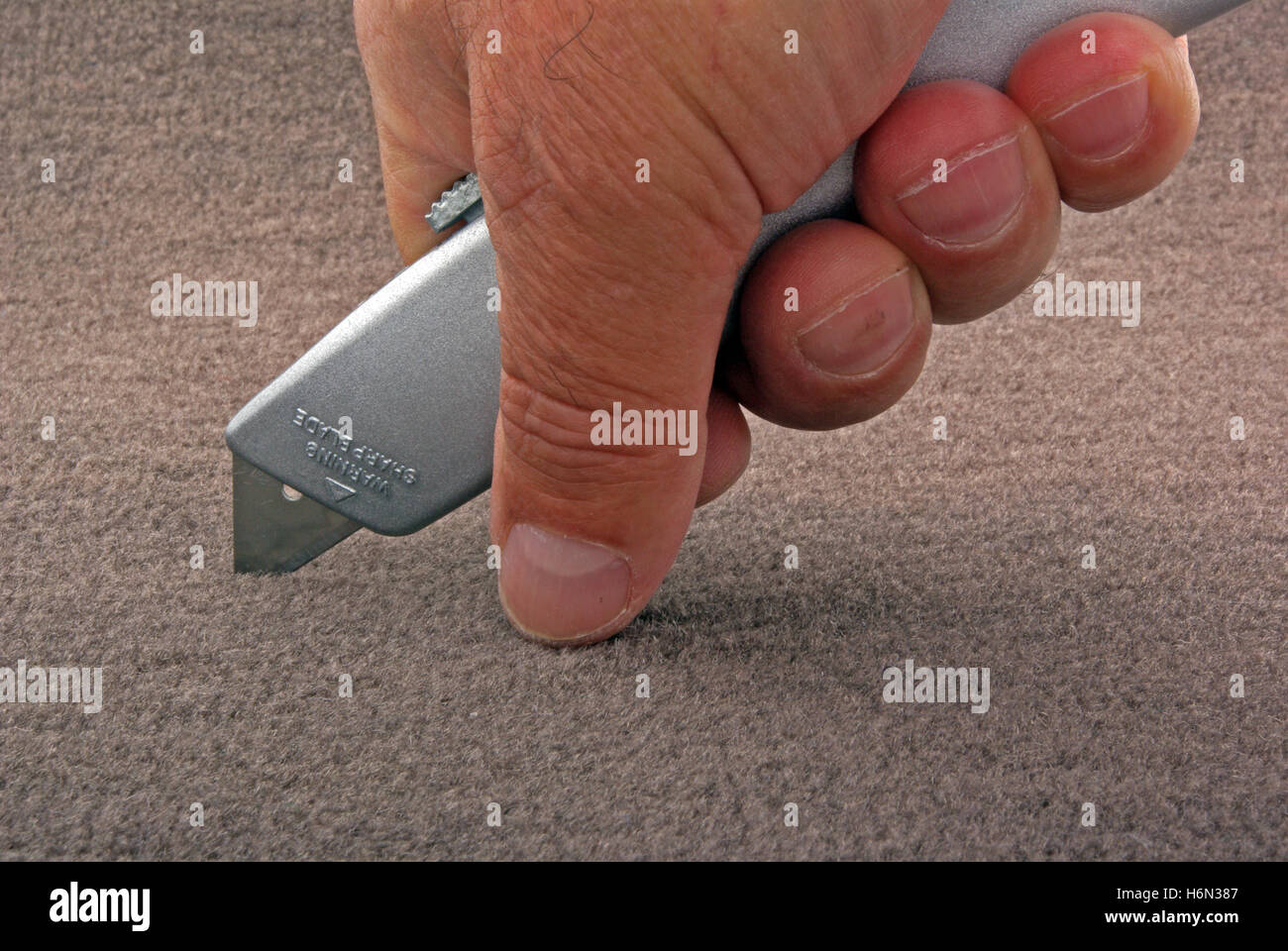 Box cutter hand hi-res stock photography and images - Alamy