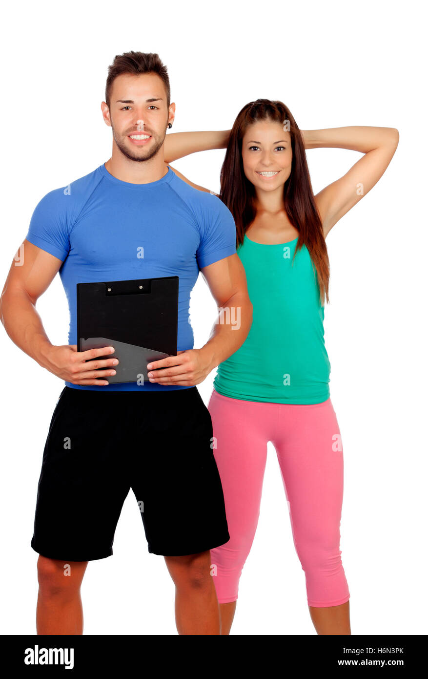Handsome personal trainer with a attractive girl isolated on a white ...