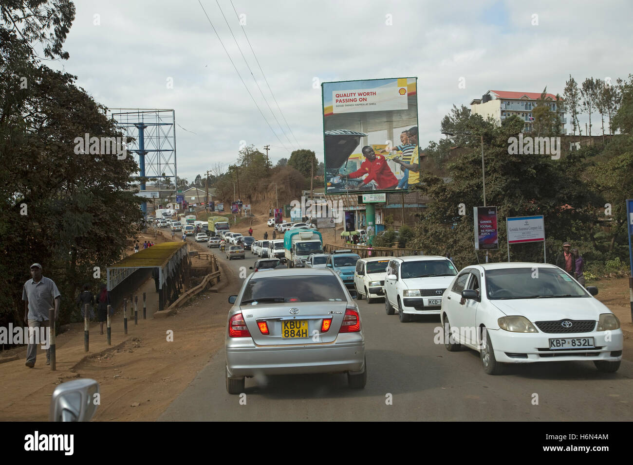 Busy road traffic billboard people Meru town Kenya Stock Photo - Alamy