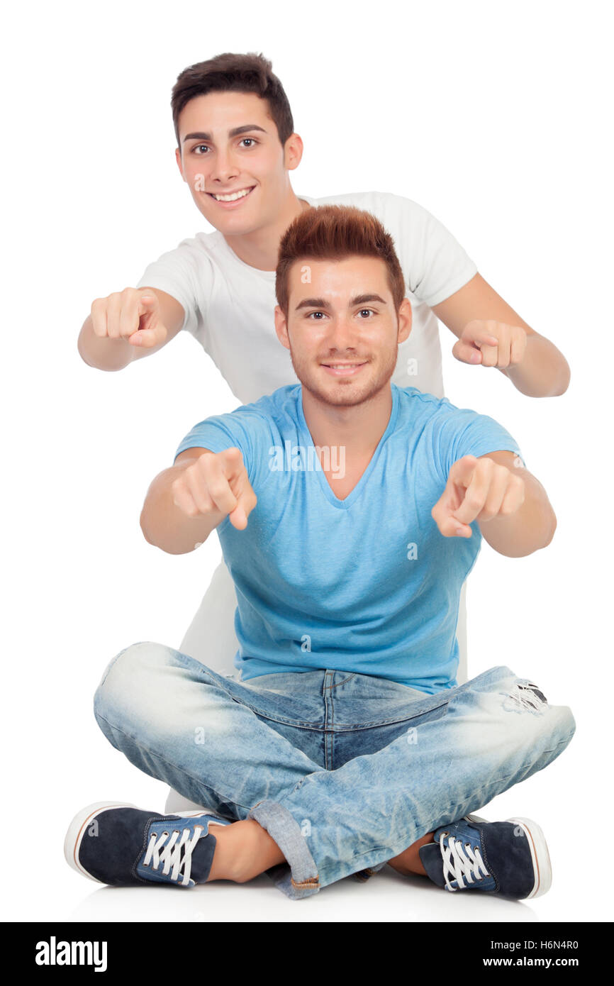 Couple of best friends pointing to the front isolated on a white ...