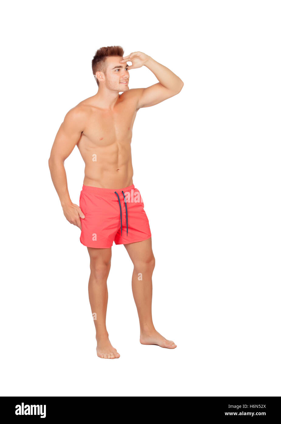 Handsome lifeguard with red swimsuit isolated on white background Stock ...