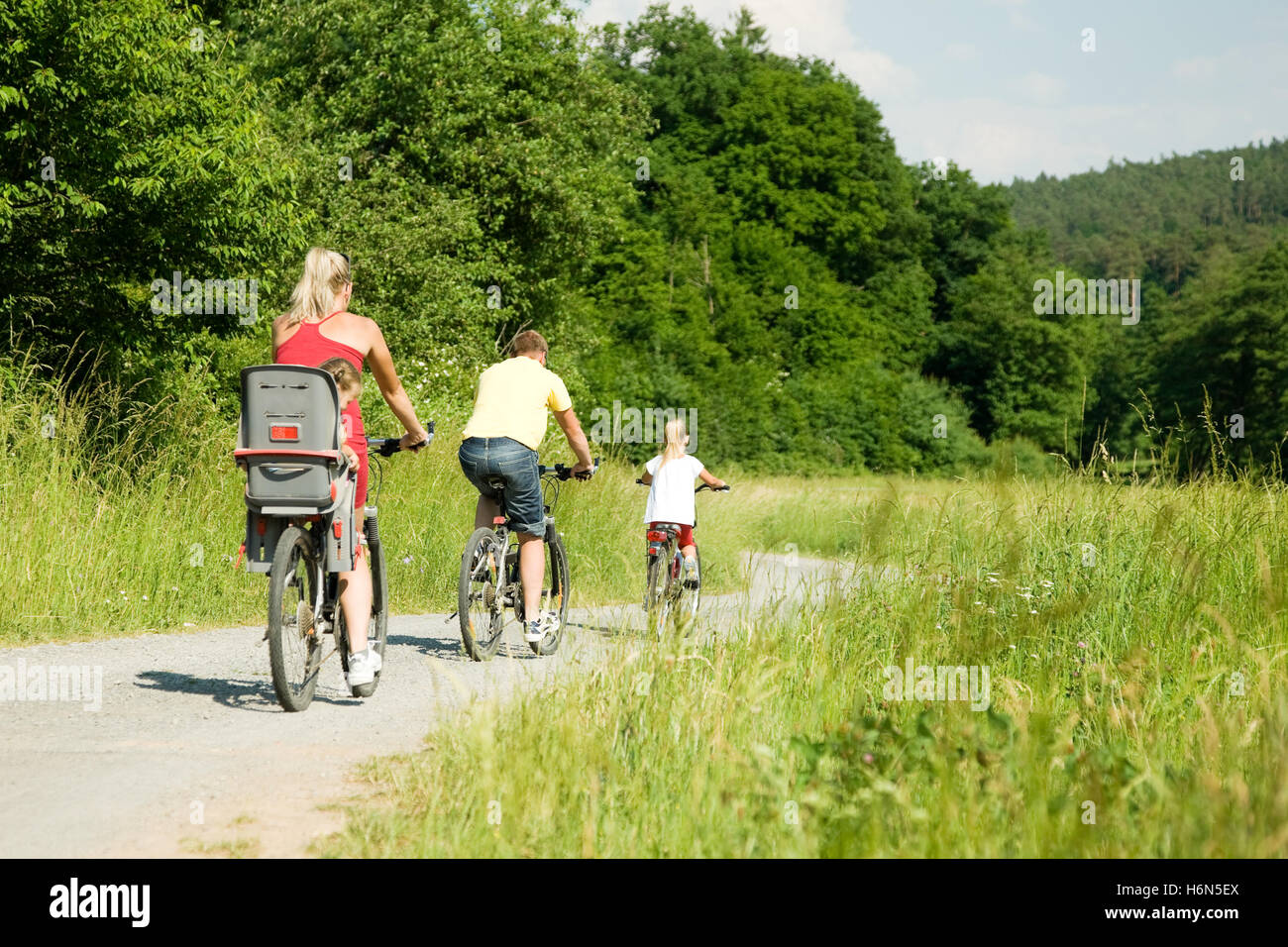 Dad And Children Biking High Resolution Stock Photography and Images ...