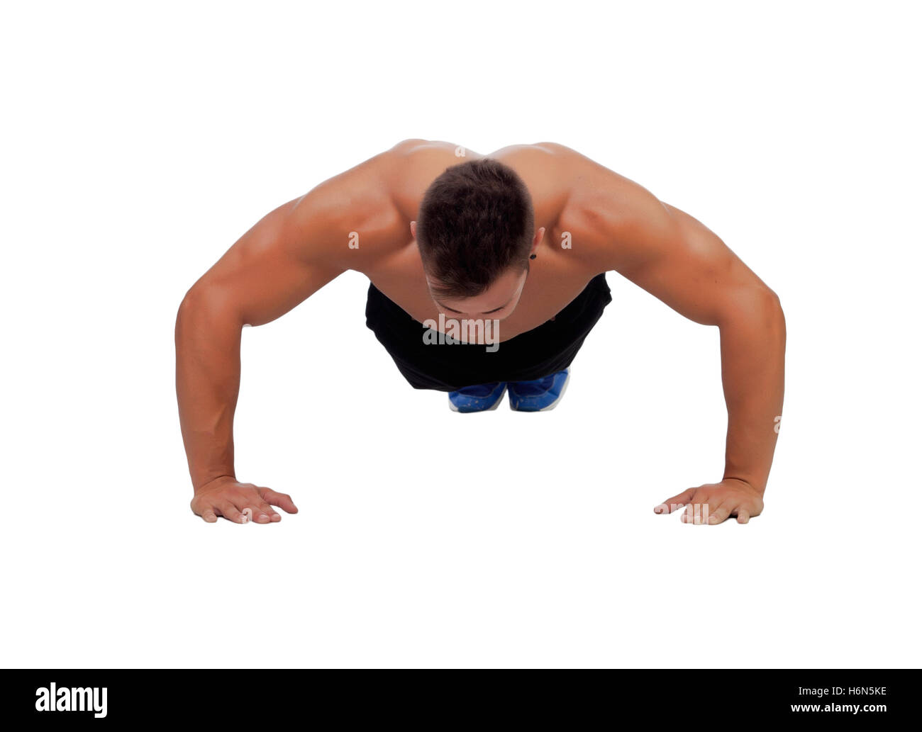 Muscular man doing pushups isolated on white background Stock Photo - Alamy