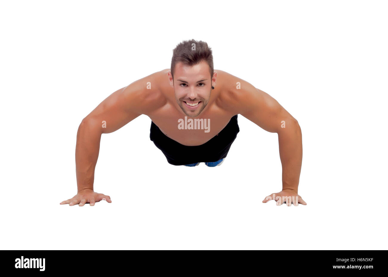 Muscular man doing pushups isolated on white background Stock Photo - Alamy